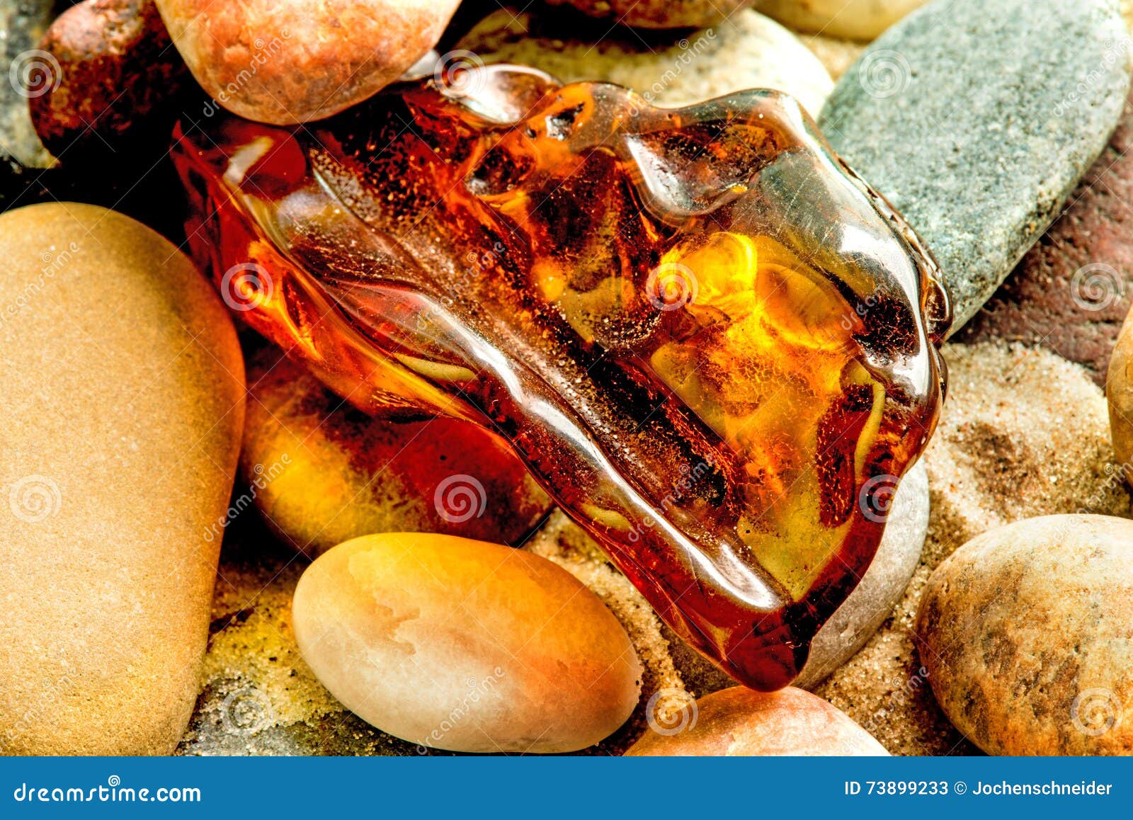 Amber on a beach stock image. Image of bright, mineral - 73899233