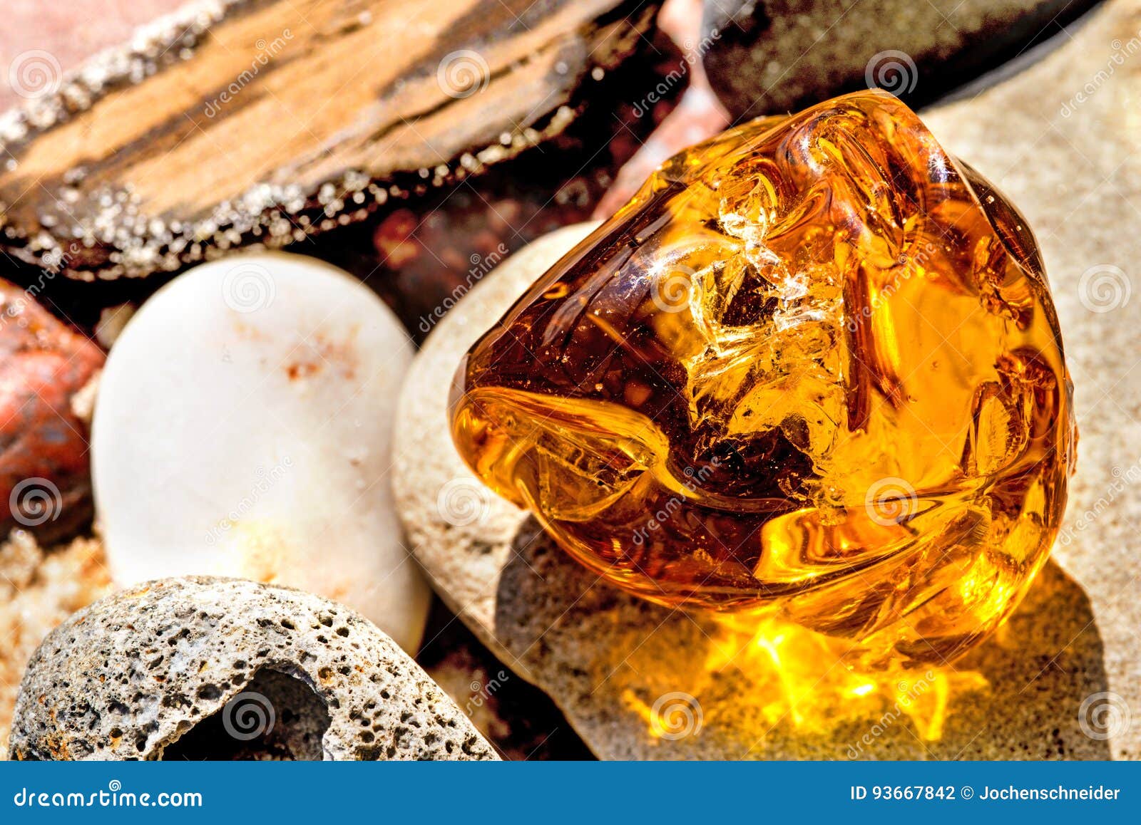 Amber on a beach stock photo. Image of precious, geology - 93667842