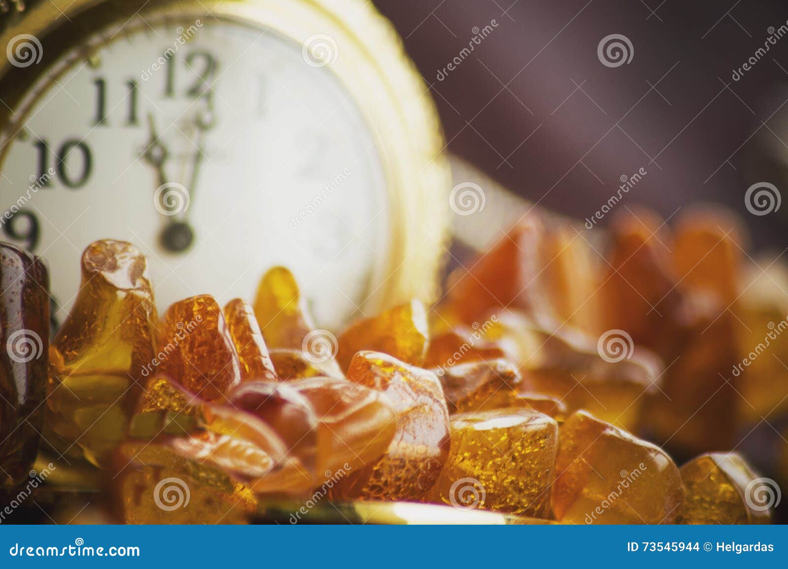 Amber and a Clock in a Background Stock Photo - Image of stone ...