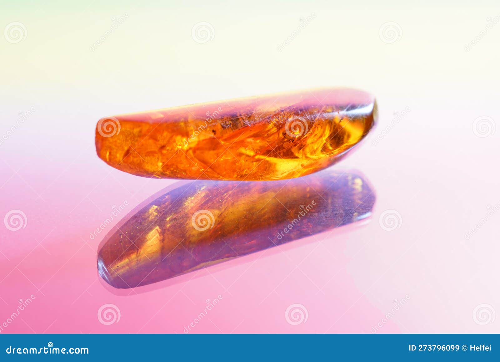 Amber Gemstone on Pink and Blue Background. Shallow Depth a Field Stock ...