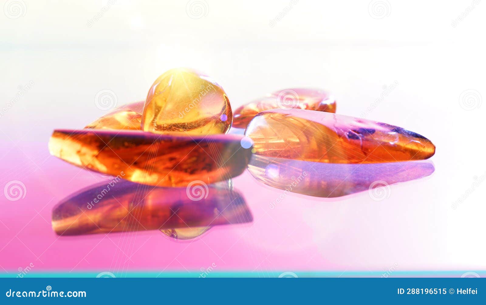 Amber Gemstone on Pink and Blue Background. Shallow Depth a Field Stock ...