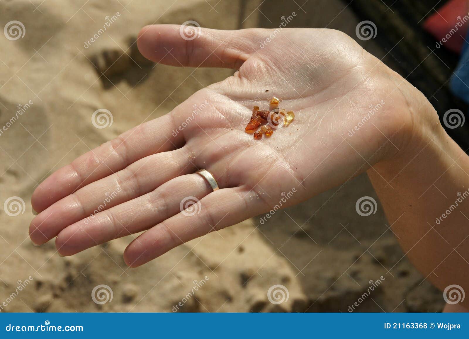 Amber on a hand stock photo. Image of hand, baltic, stones - 21163368