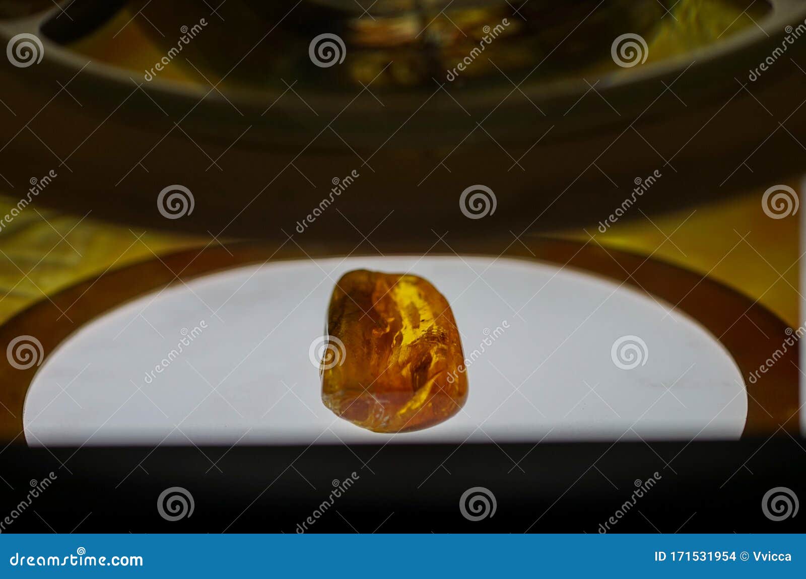 Amber Stone Under a Microscope on a Light Surface Editorial Stock Image ...