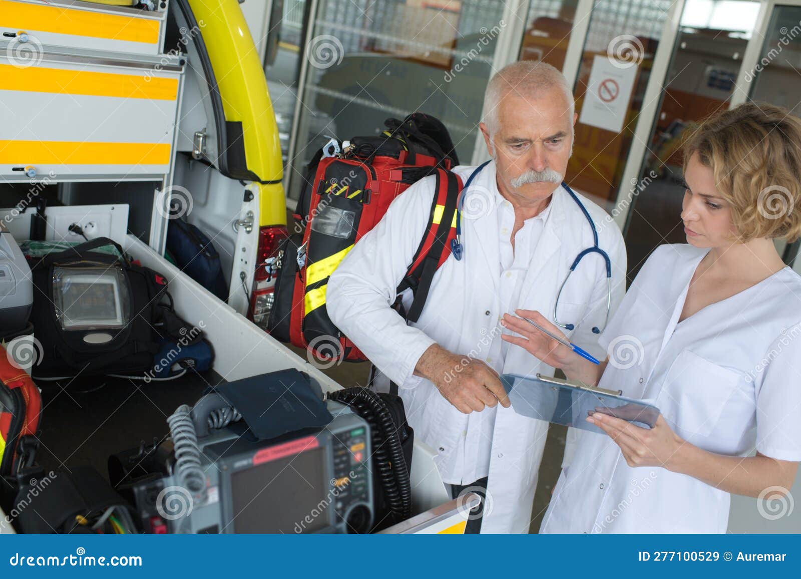 Ambulance Doctors Discussing Something Stock Image - Image of symptom ...