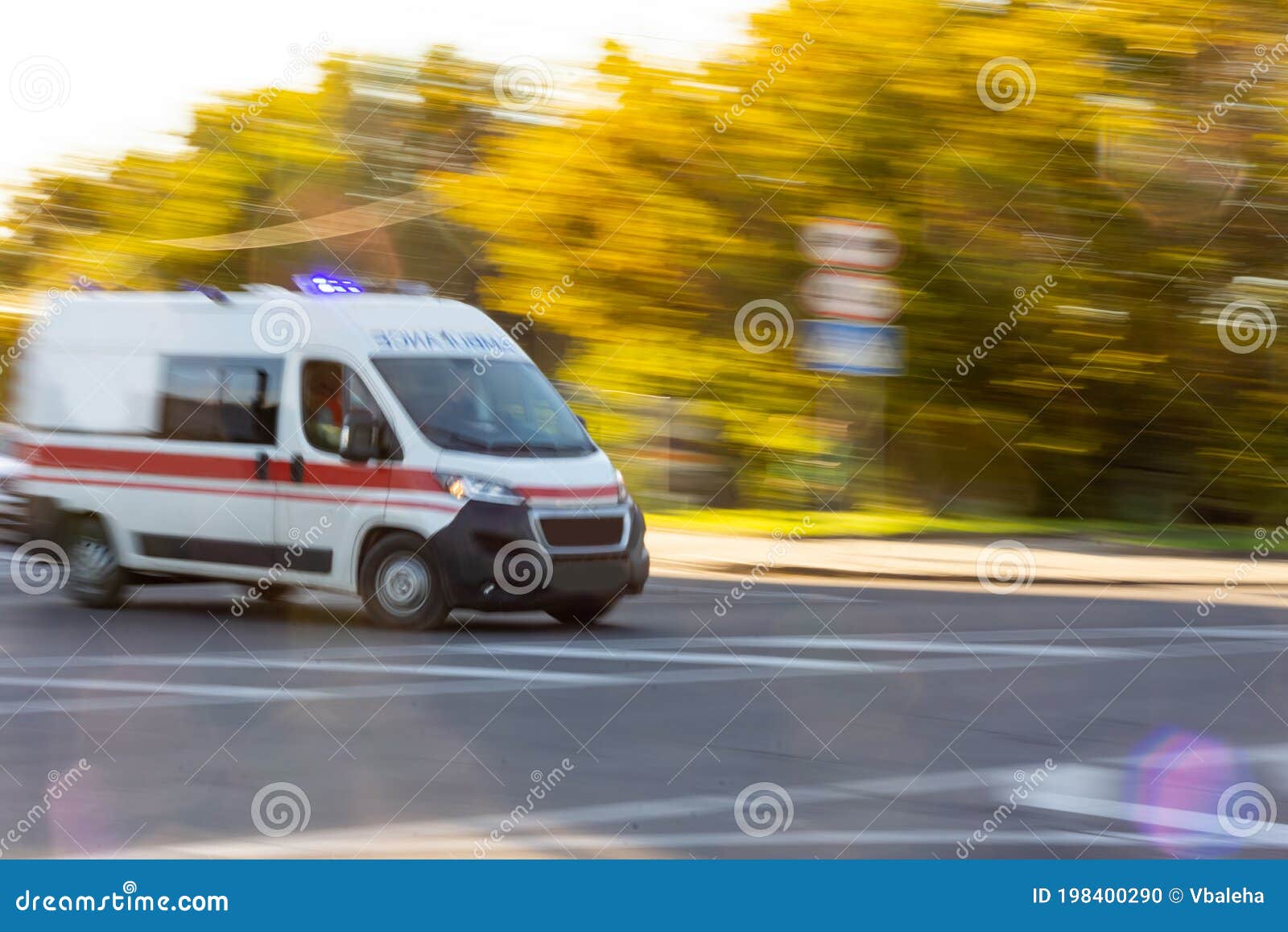 Ambulance in Motion Driving Down the Road. Intentional Motion Blur ...