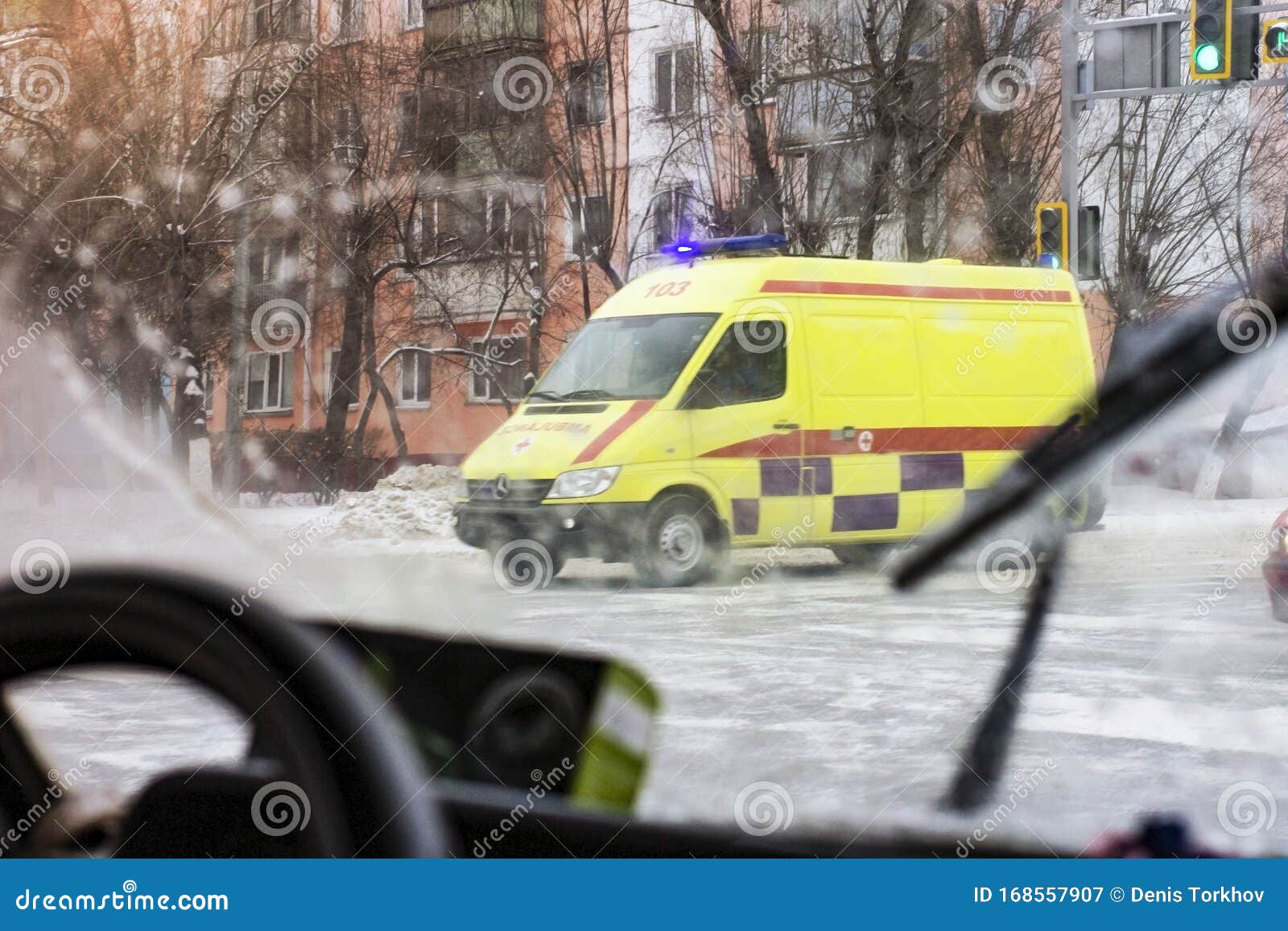 Ambulance View from the Car through the Wipers and Windshield in the ...