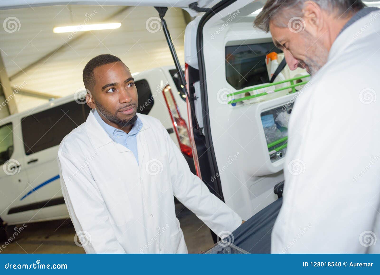 Ambulance Workers Looking at Eachother Stock Photo - Image of ...