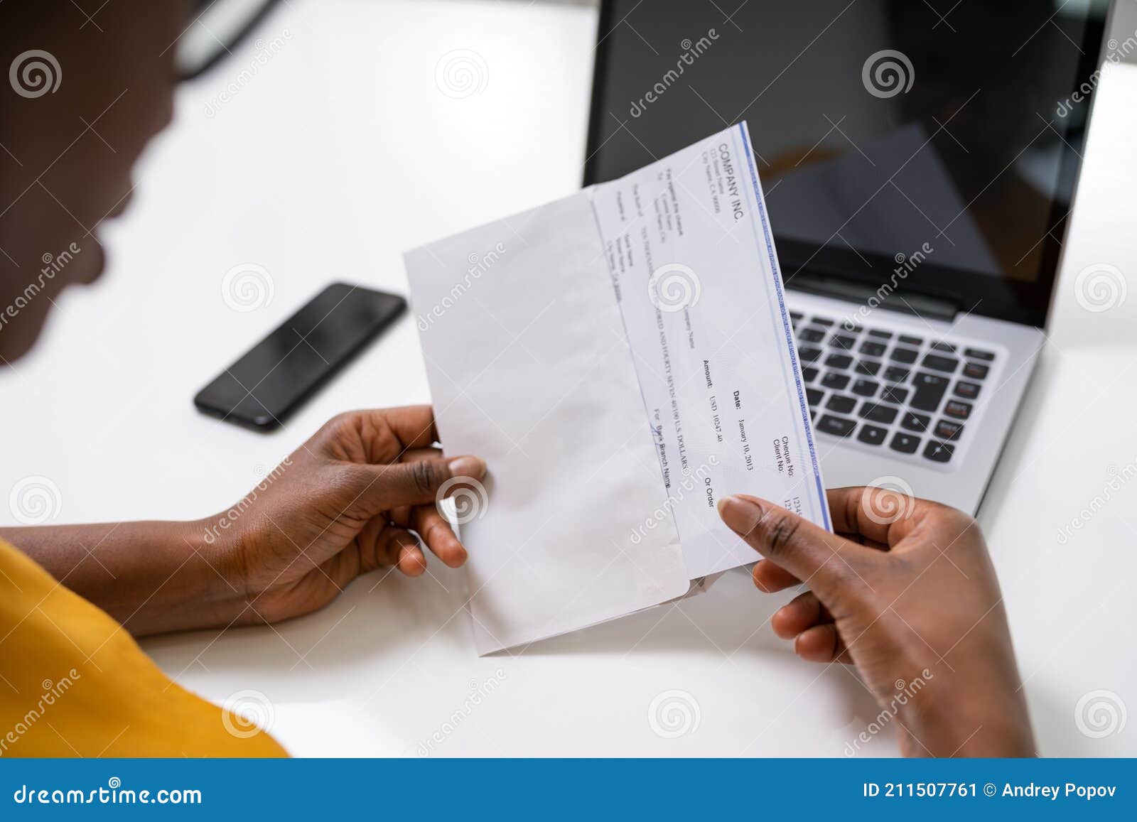 Holding Paycheck Or Payroll Check Or Insurance Cheque Royalty-Free ...