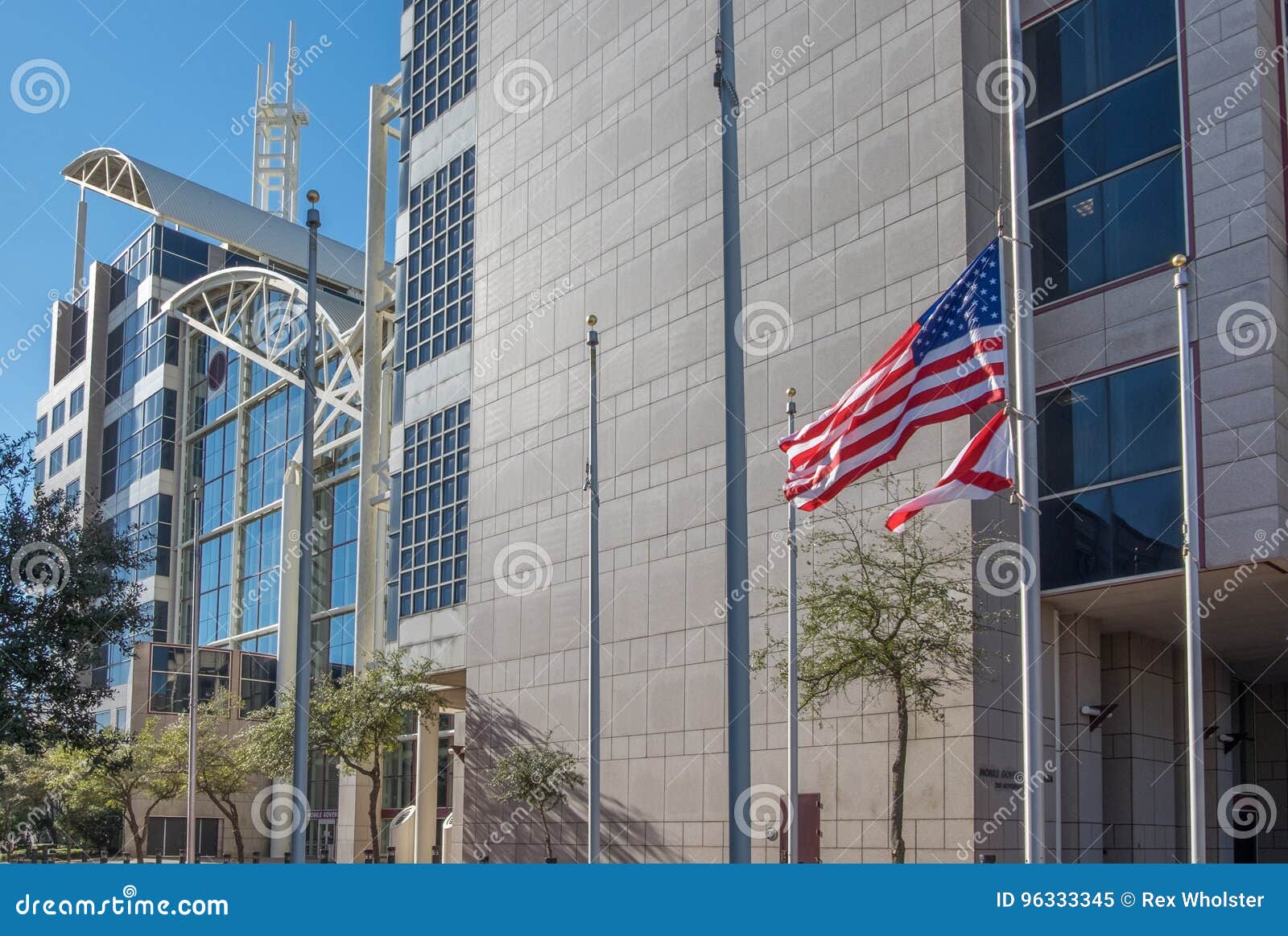 American and Alabama Flags Fly in Front of the Mobile County Courthouse ...