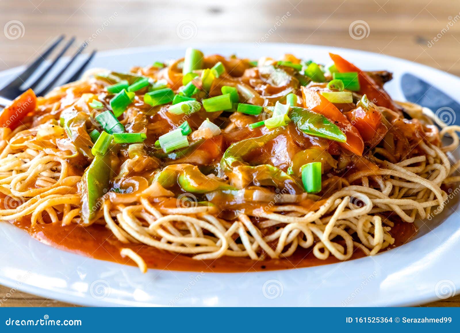 American Chopsuey Served in a White Plate on Wooden Surface Stock Photo ...
