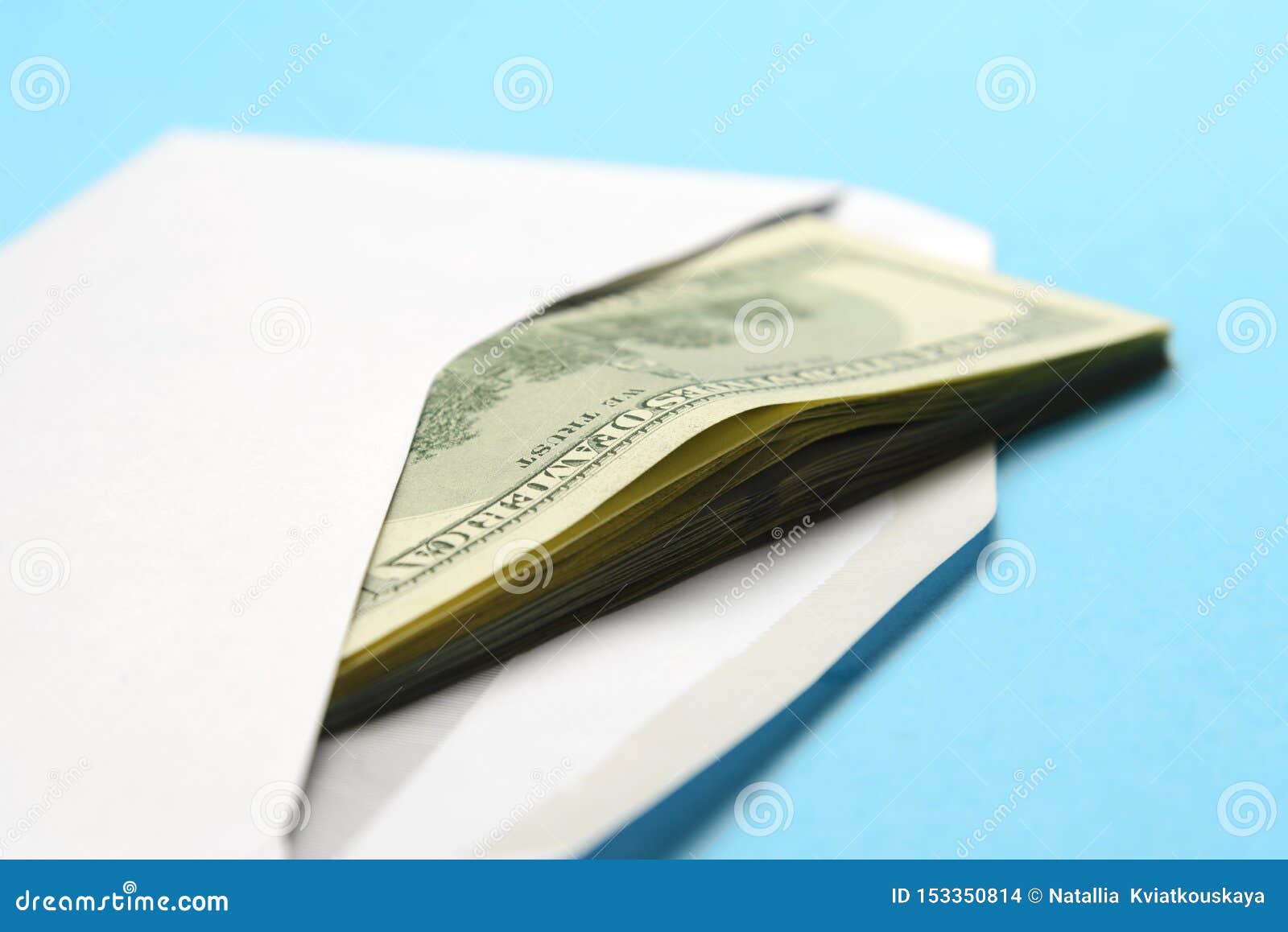 American Dollars in Open White Postal Envelope on a Blue Background ...