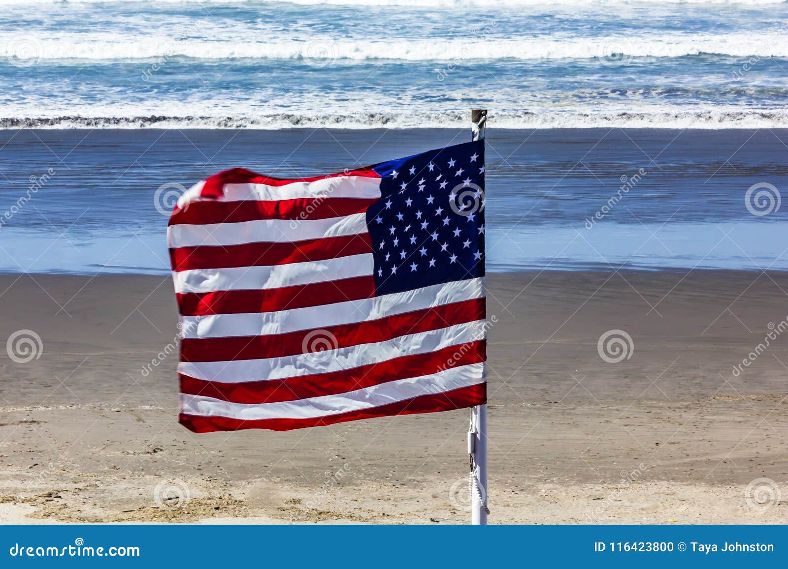 American Flag Blowing in the Wind Stock Photo - Image of celebration ...