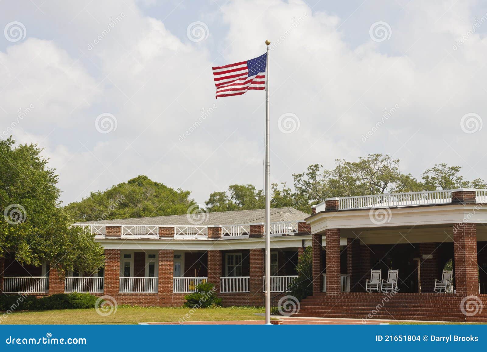 American Flag on Flagpole Outside Brick Pavilion Stock Photo - Image of ...