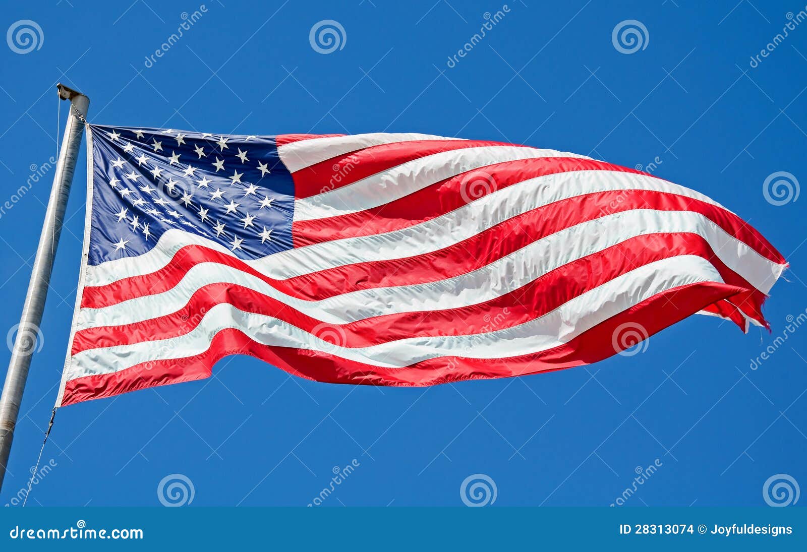 American Flag Flying in Bright Blue Sky Stock Photo - Image of breeze ...