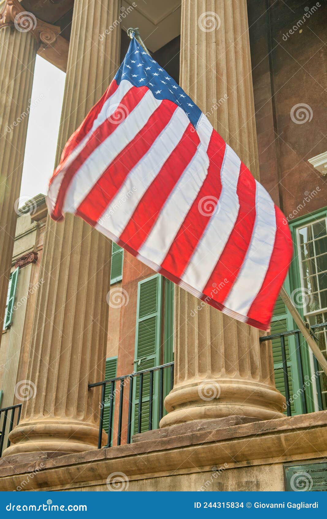 American Flag in Front of Monumental Building Stock Photo - Image of ...