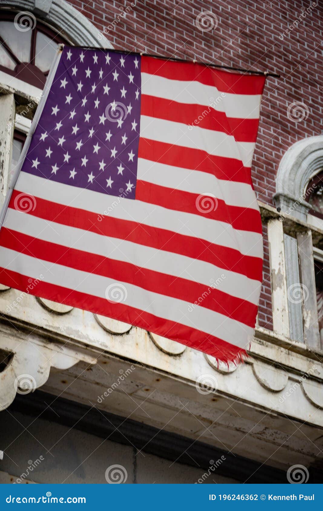 American Flag in Front of Old Style Building Stock Photo - Image of ...