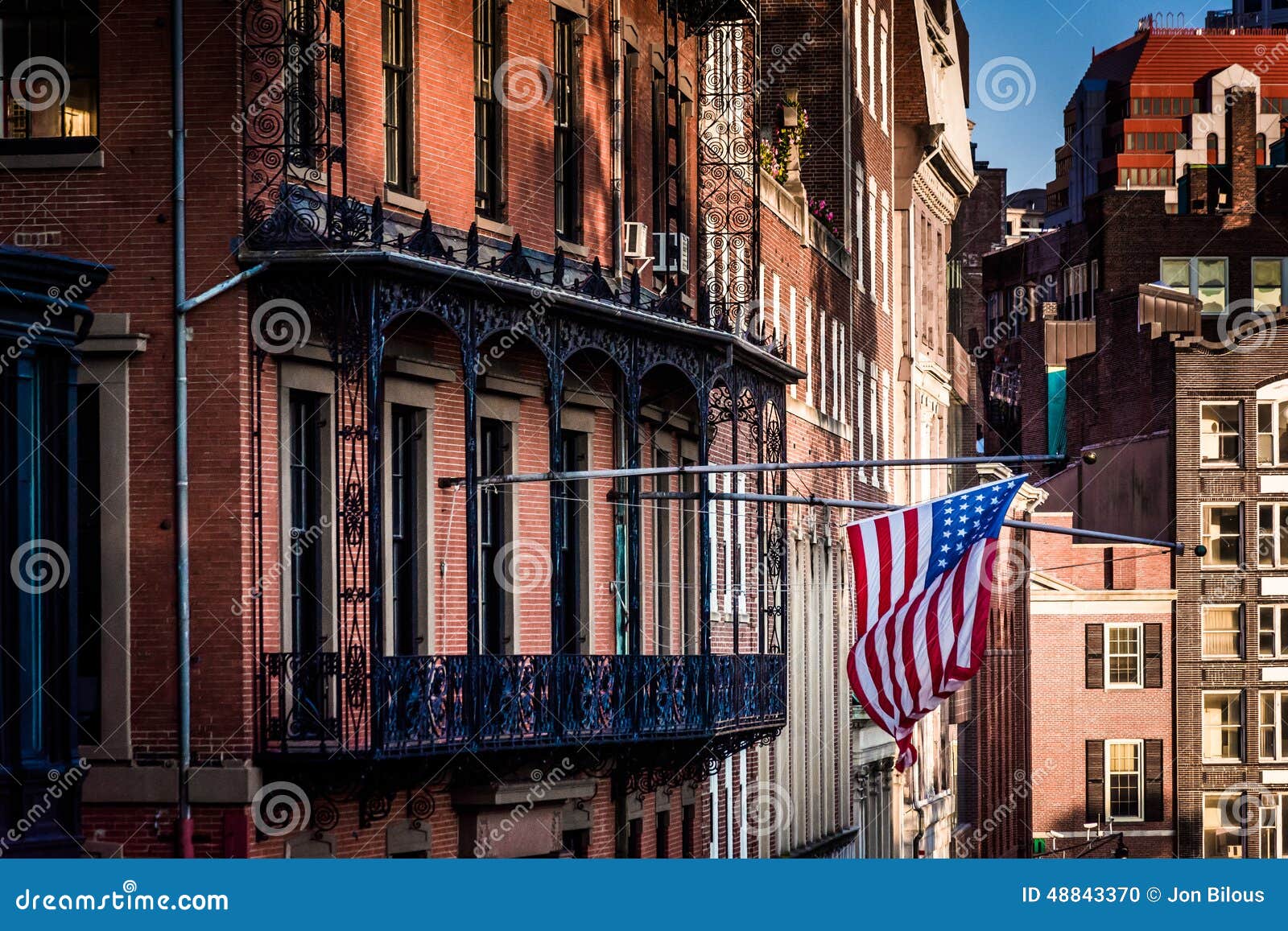 American Flag Hanging from a Building in Boston, Massachusetts. Stock ...