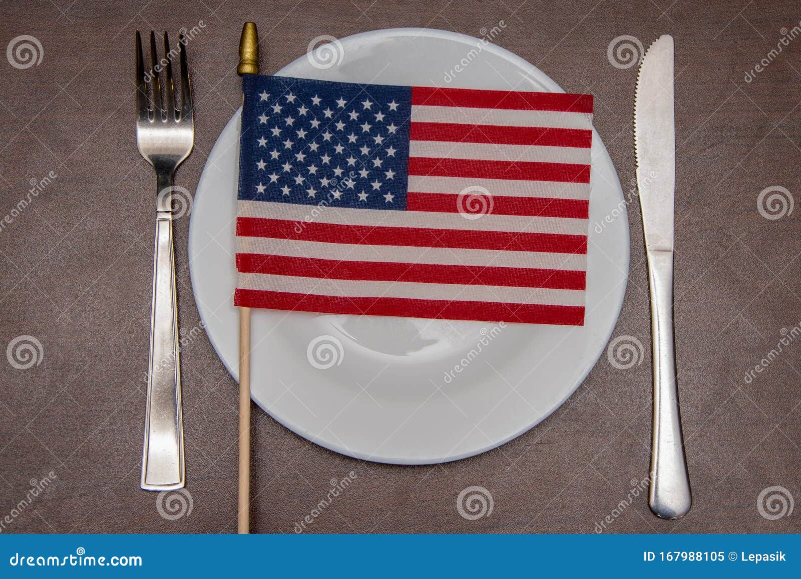 The American Flag Lies on a Plate between a Knife and a Fork Stock ...