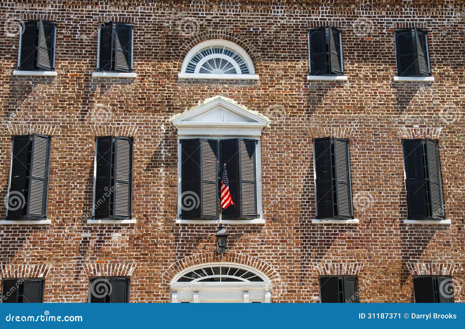American Flag on Old Brick Building Stock Image - Image of building ...