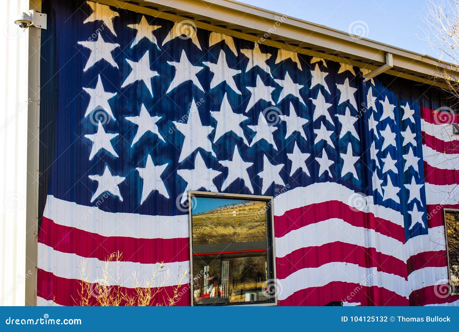 American Flag on Side of Building Stock Photo - Image of flag, reflects ...