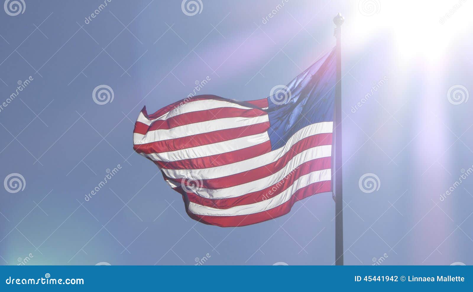 American Flag with Sun Rays Backlighting Stock Photo - Image of sunrays ...