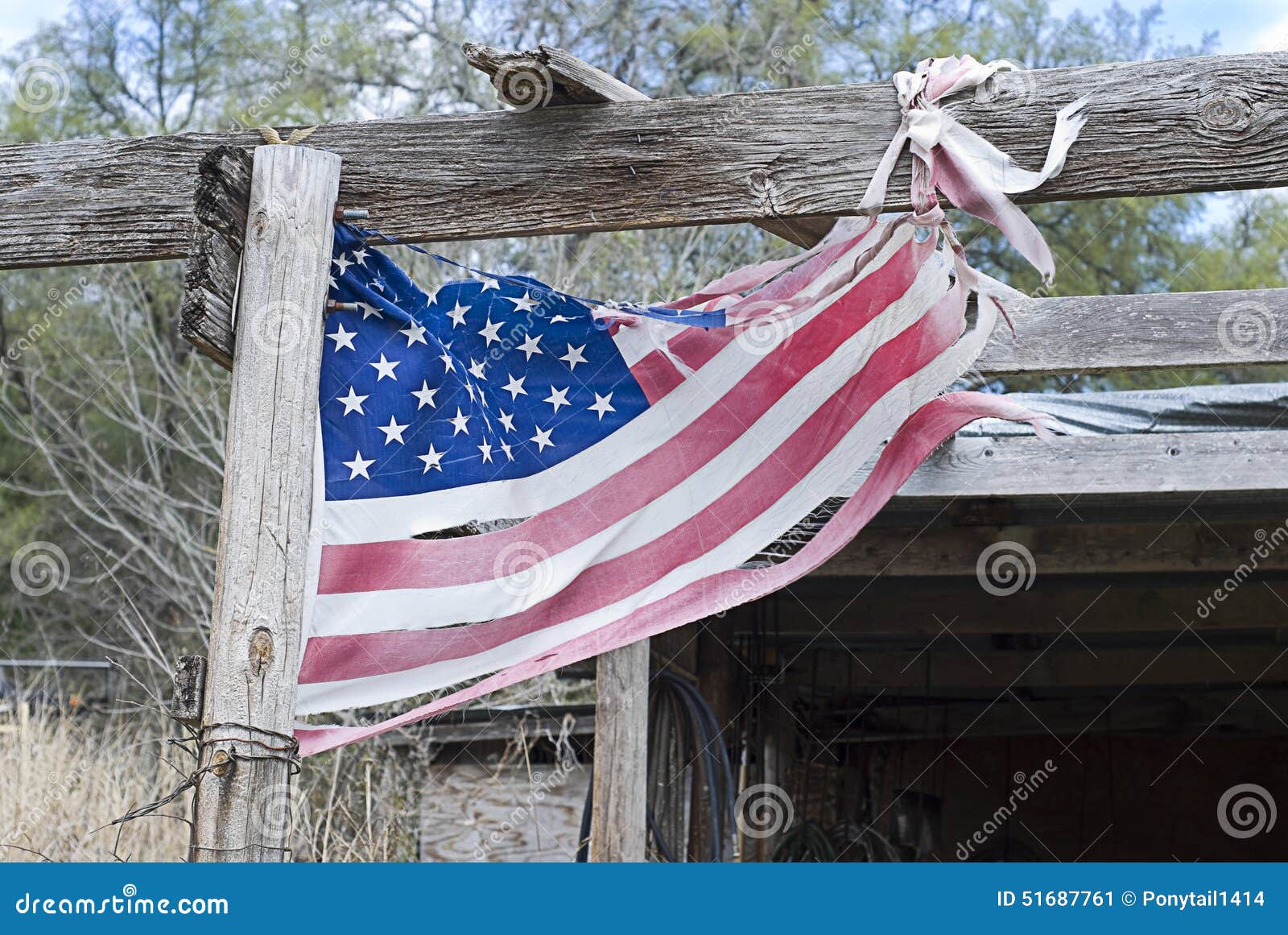 Displaying A Tattered American Flag