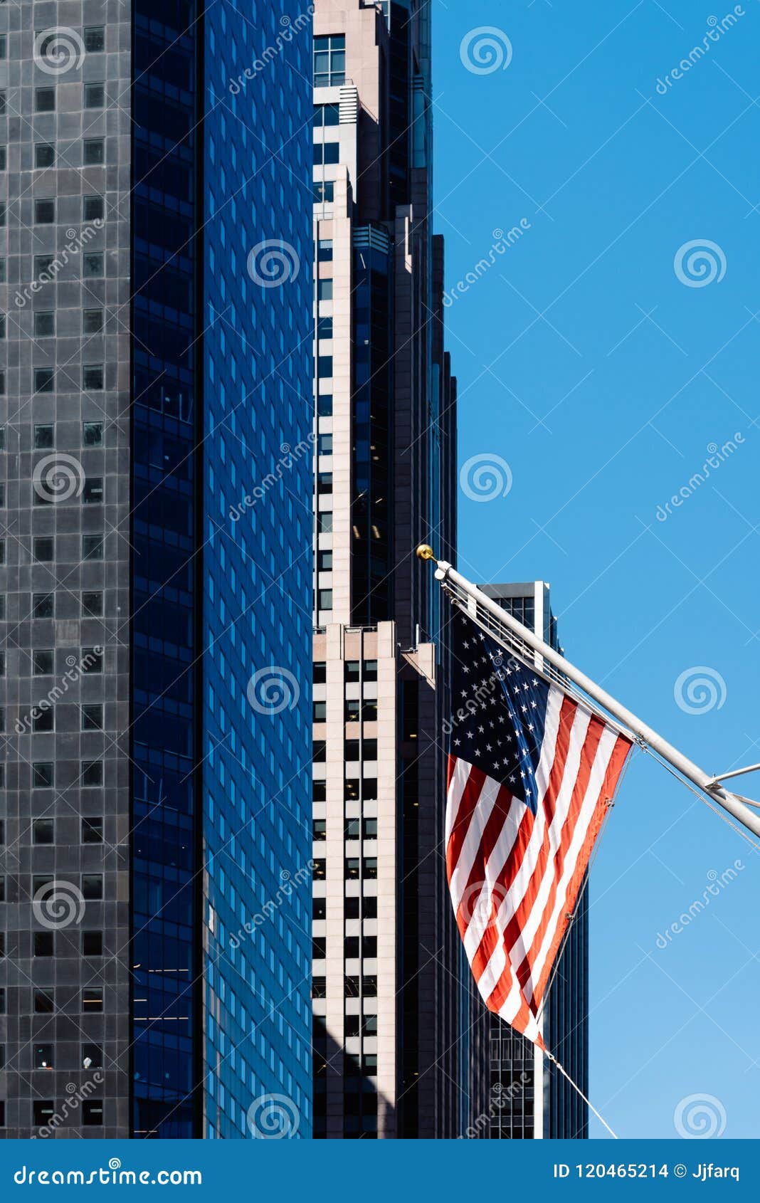 American Flag Waving Against Modern Office Building Stock Photo - Image ...