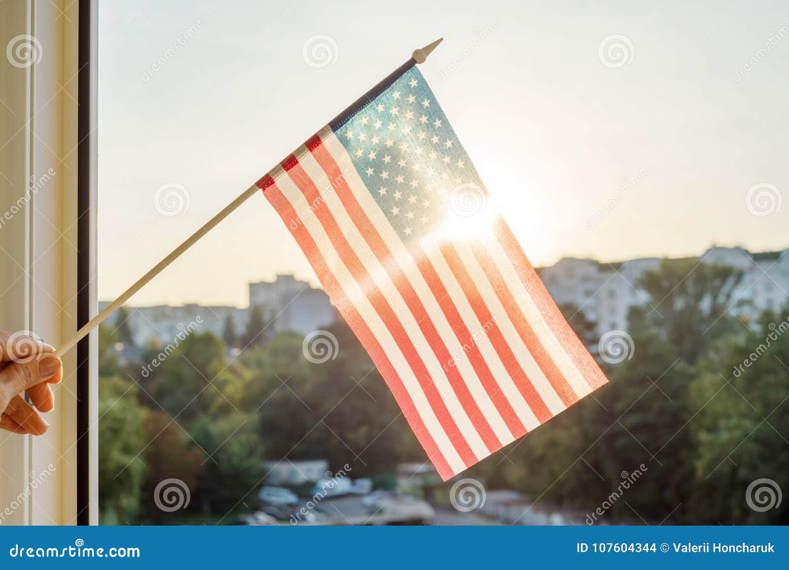 American Flag from the Window on a Sunset Background Stock Photo ...