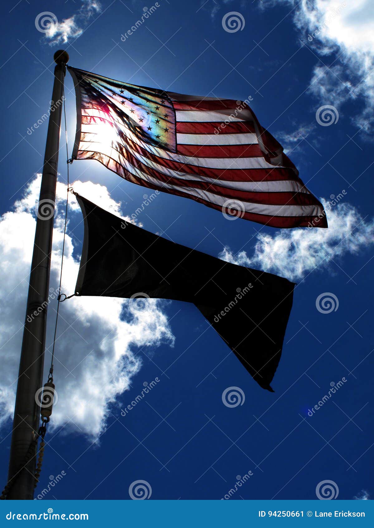American Flag on Windy Day Sunlight Blue Sky and Clouds Stock Image ...