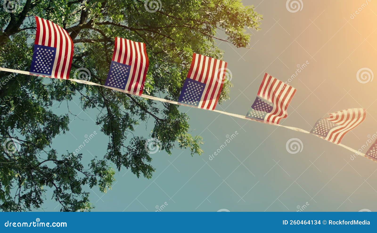 American Flags Flapping in Sun Glow Stock Footage - Video of ...