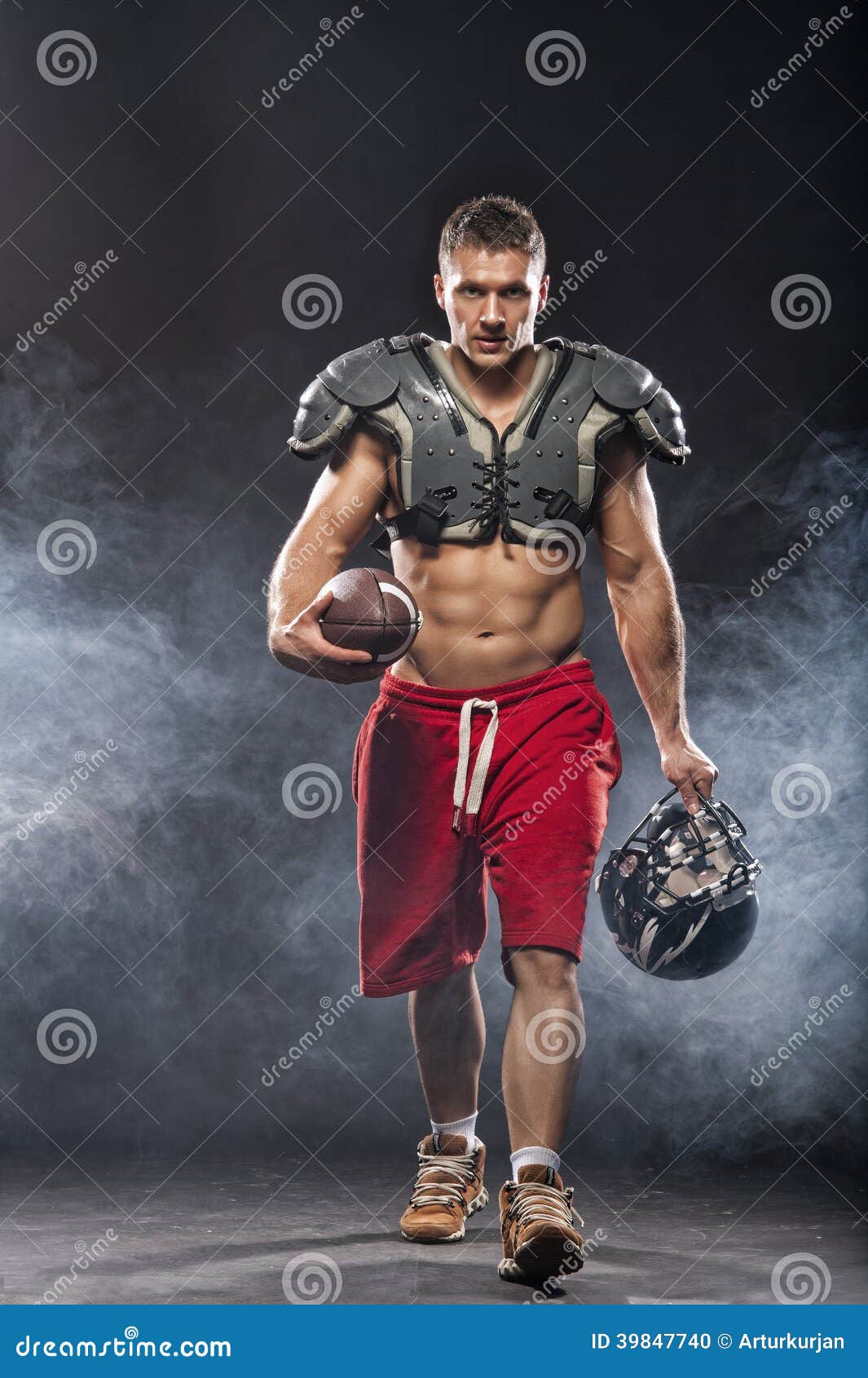 American Football Player Posing Stock Photo - Image of helmet, abdomen ...