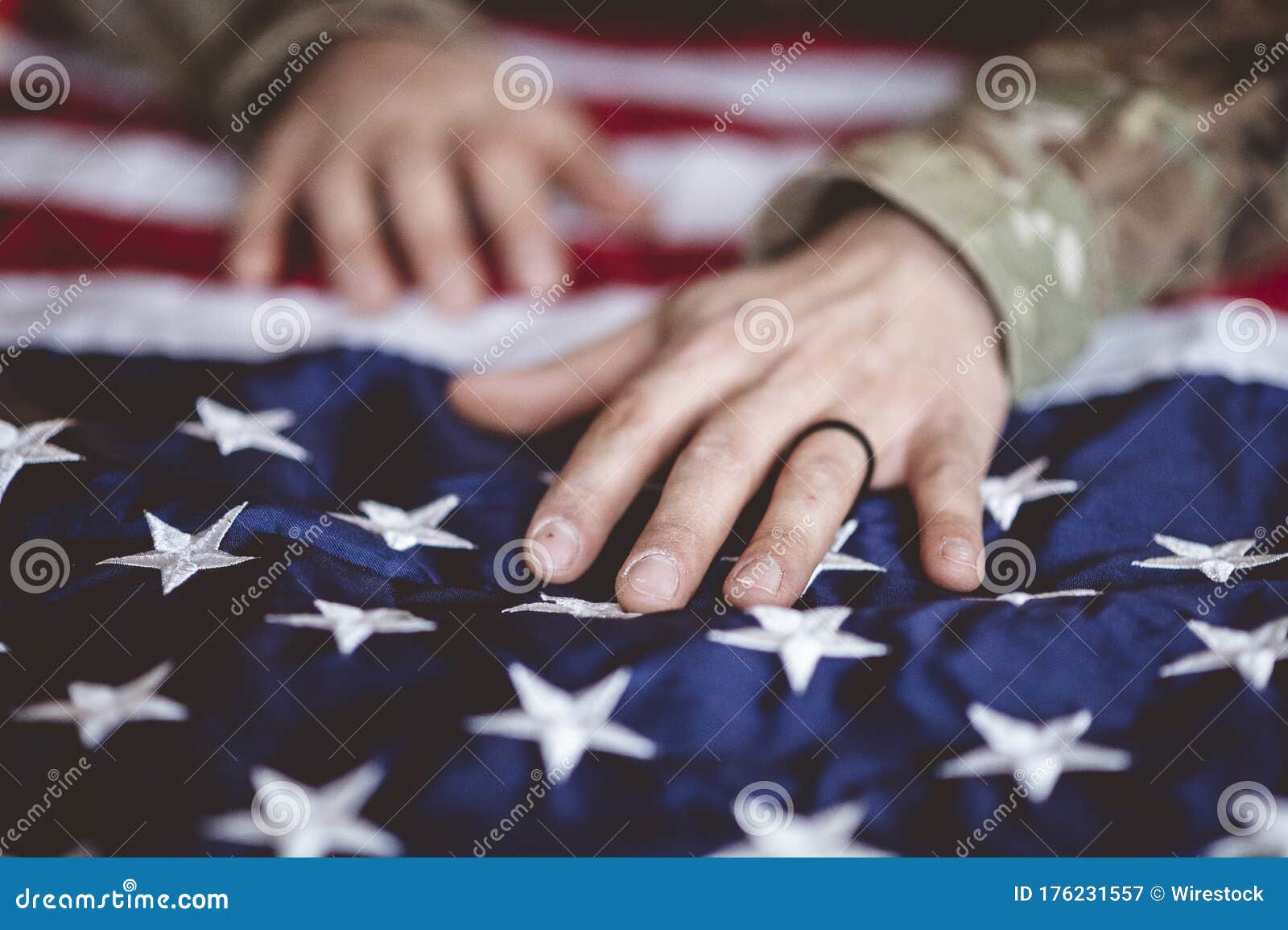American Soldier Mourning and Praying with the American Flag in Front ...