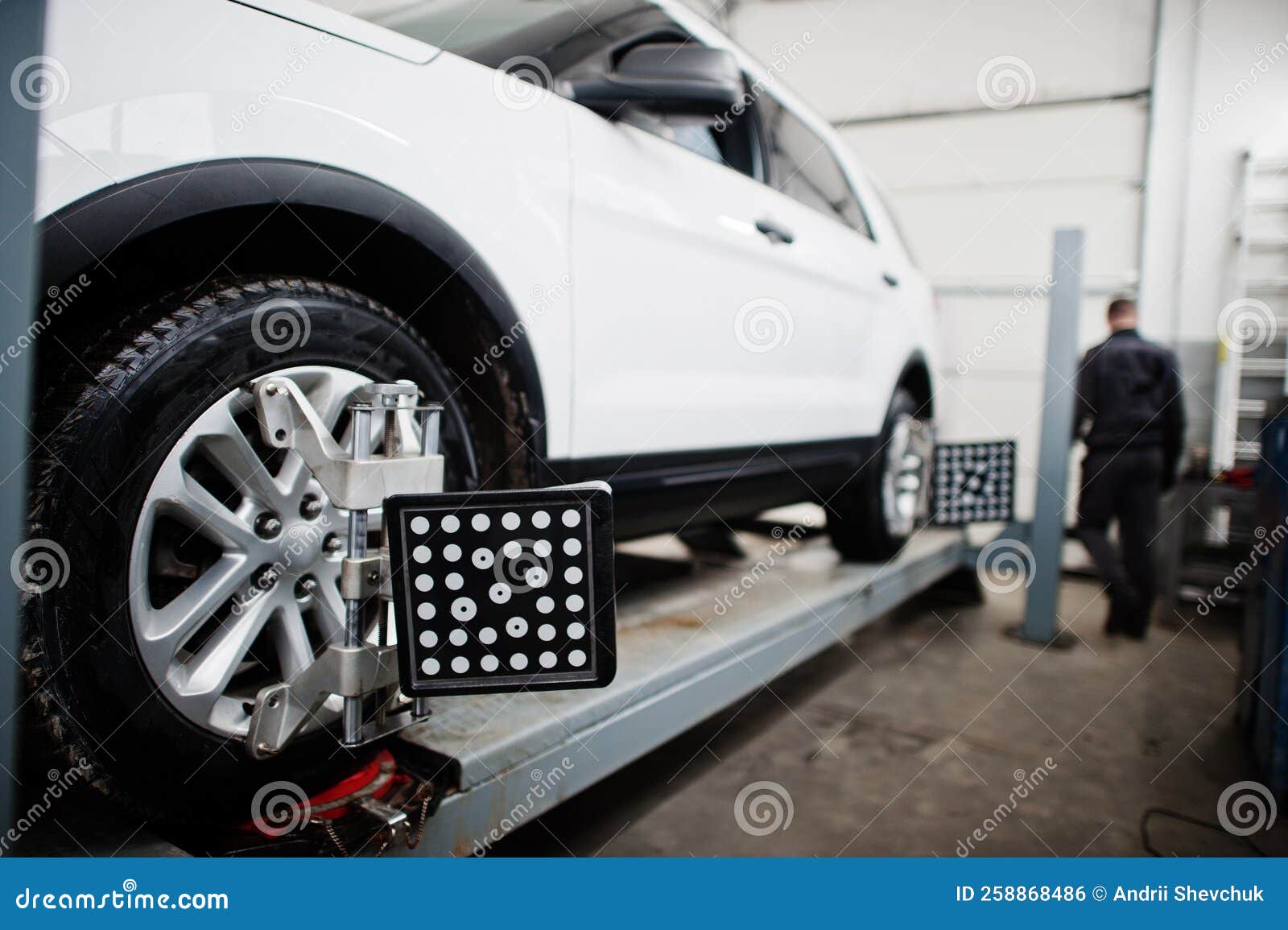 American SUV Car on Stand for Wheels Alignment Camber Check in Workshop ...