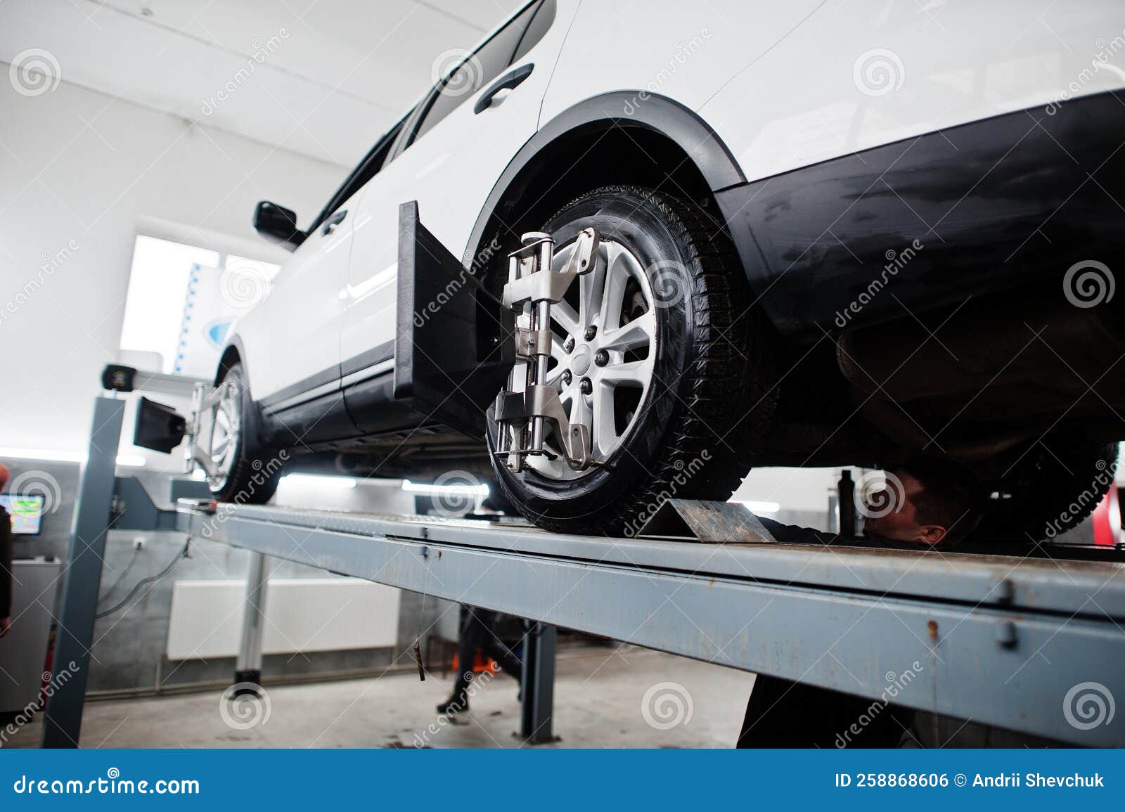 American SUV Car on Stand for Wheels Alignment Camber Check in Workshop ...