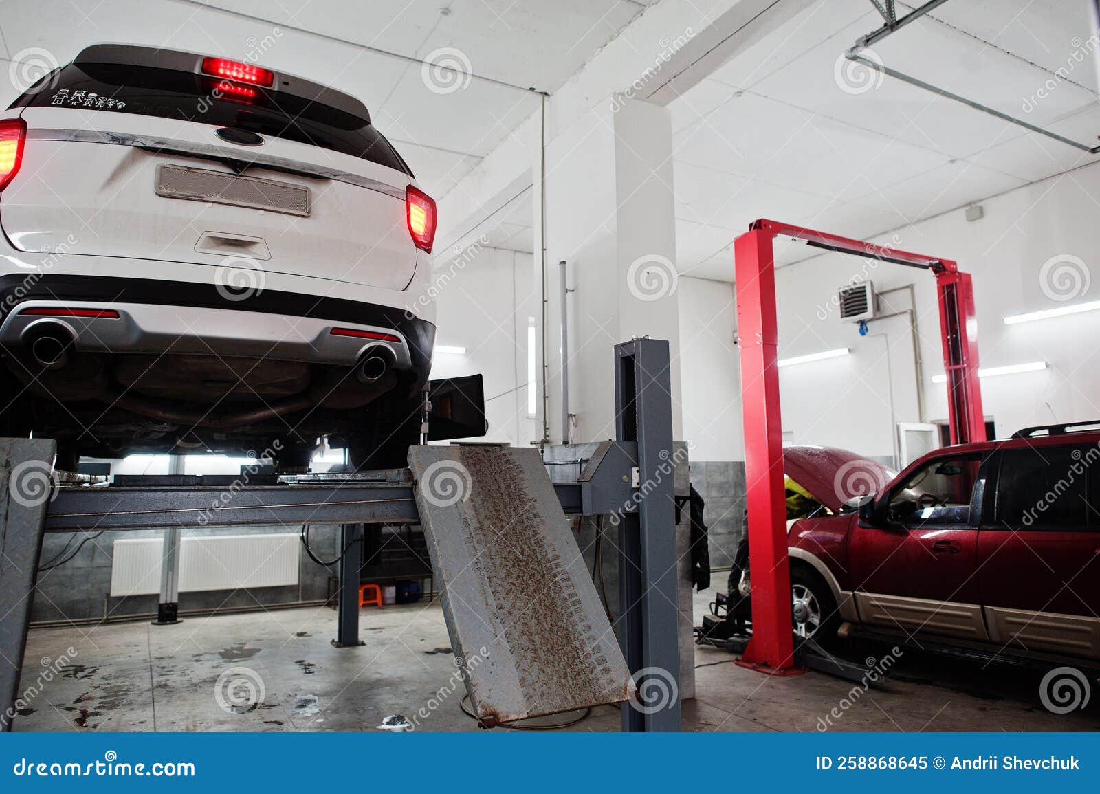 American SUV Car on Stand for Wheels Alignment Camber Check in Workshop ...
