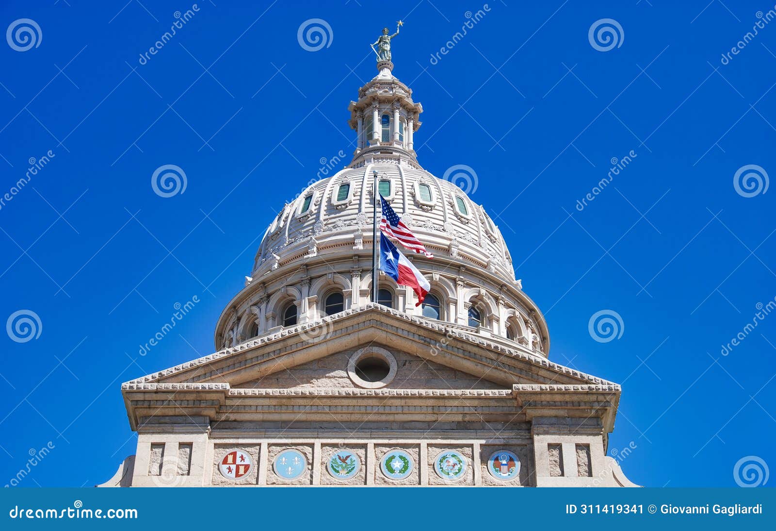 American and Texas State Flags Flying on the Dome of the Texas State ...