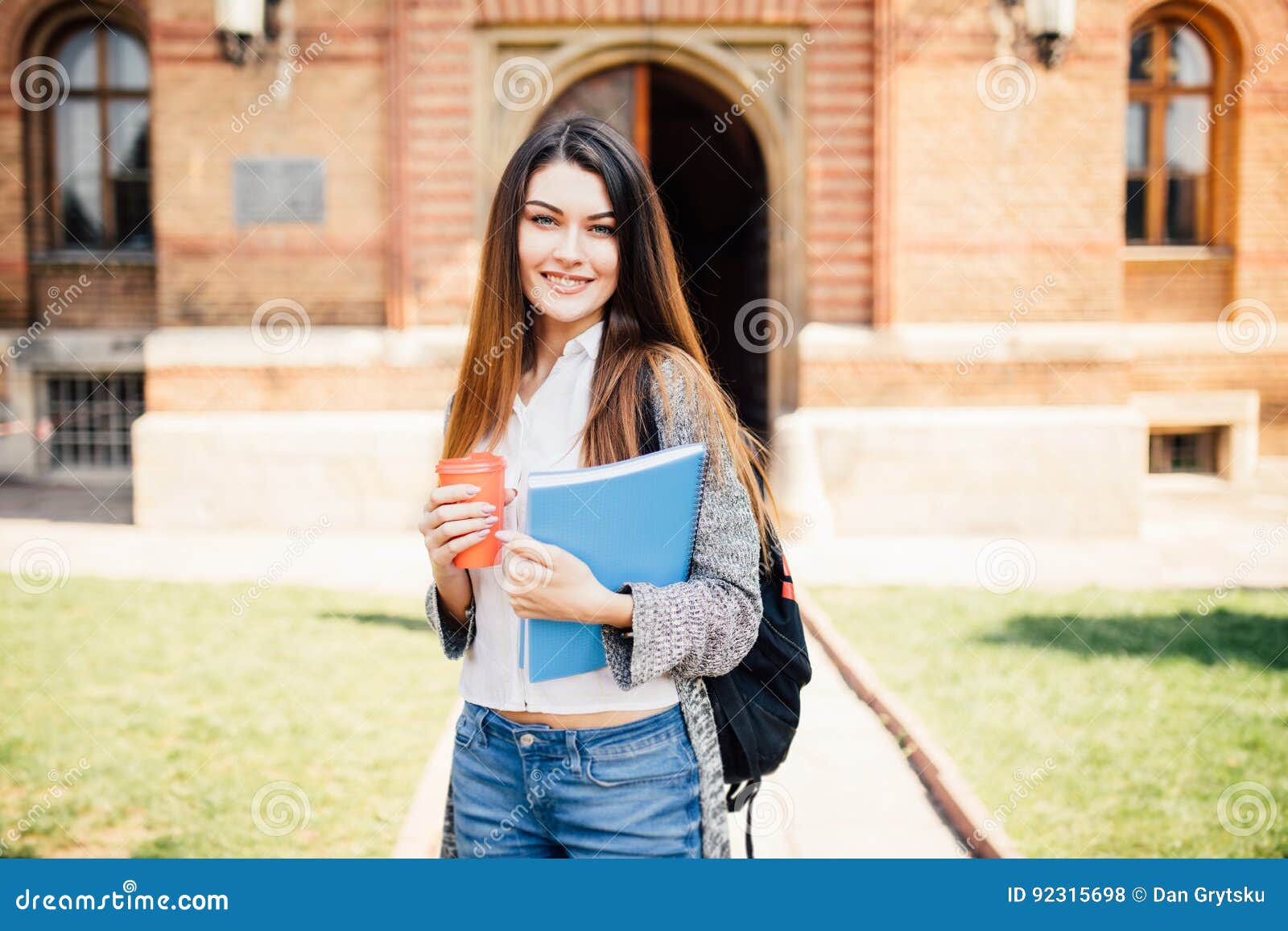 American University Student Smiling with Coffee and Book Bag on Campus ...