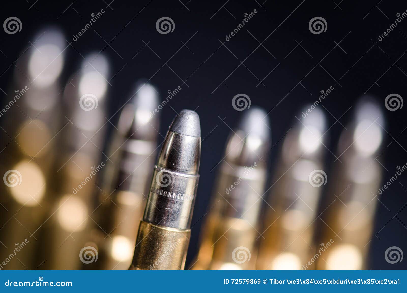 Ammunition on a Dark Blue Background with Reflection in a Glass. Close ...