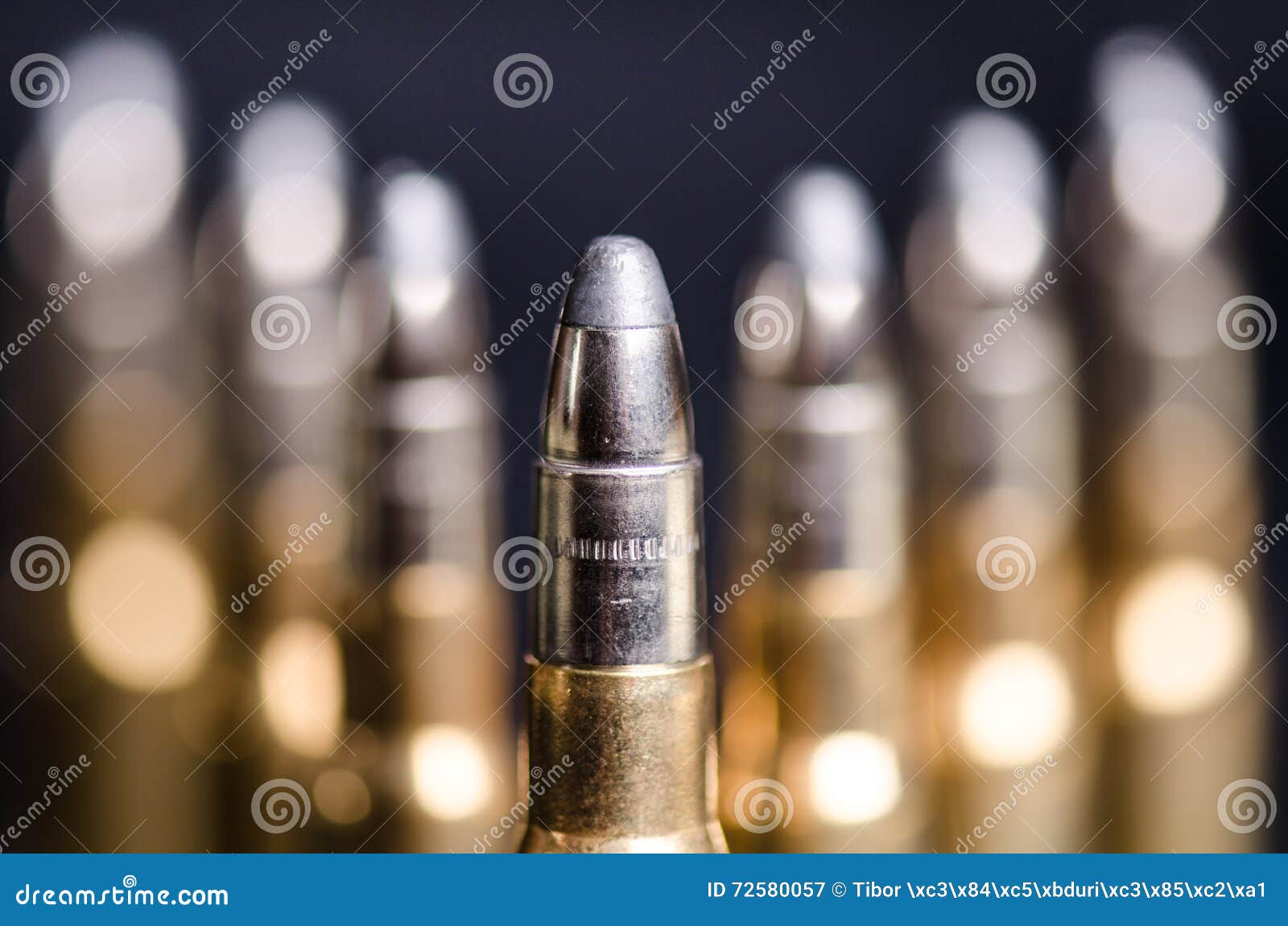 Ammunition on a Dark Blue Background with Reflection in a Glass. Close ...