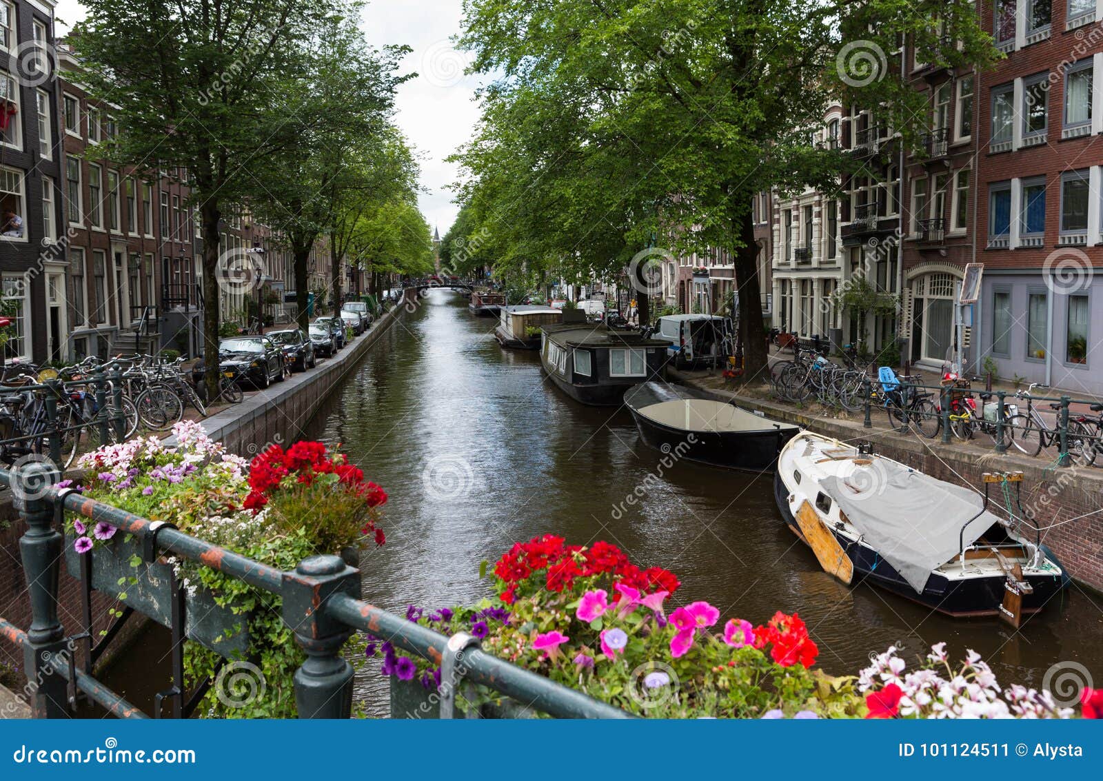 Amsterdam Canal With Flowers Stock Image Image Of Bridge Buildings 101124511