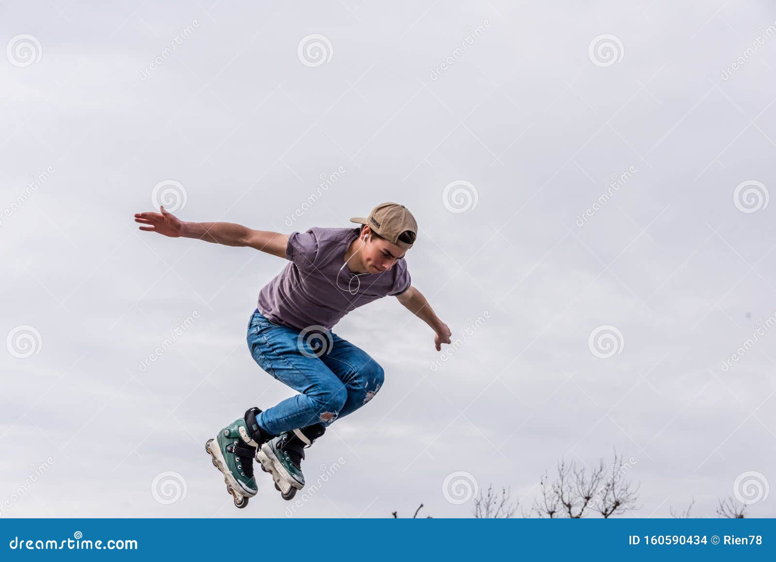 Rollerskater on Halfpipe Flying through the Air from a Low Angle ...