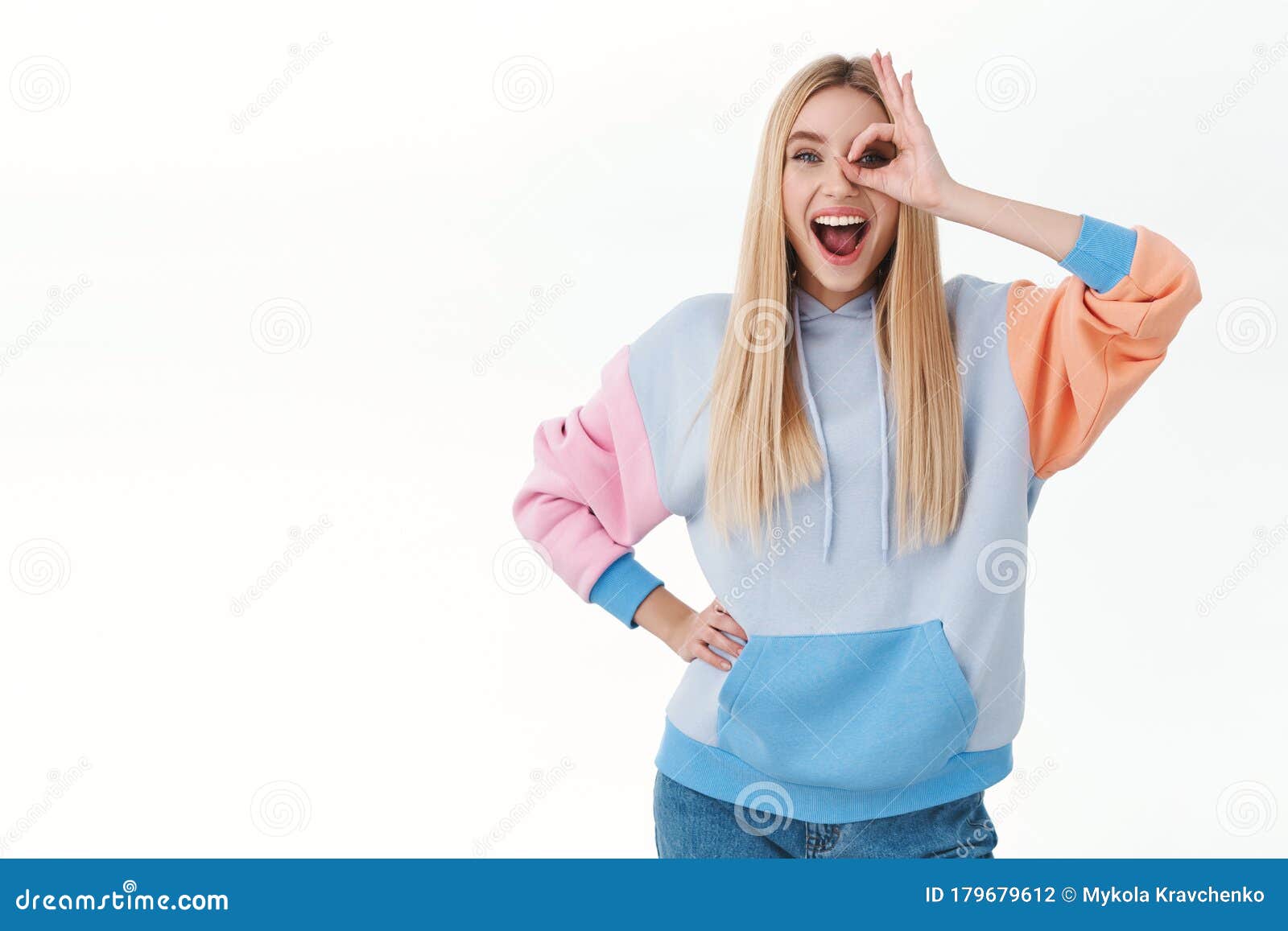 Amused Excited Happy Smiling Blonde Girl With Long Hair Showing Okay