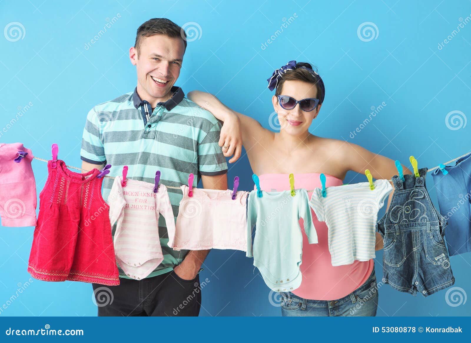 Amused Parents Doing the Laundry Stock Photo - Image of preparation ...