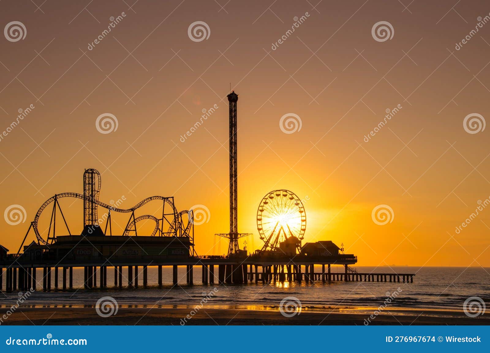 Amusement Park on the Beach at Sunset Stock Photo - Image of adventure ...
