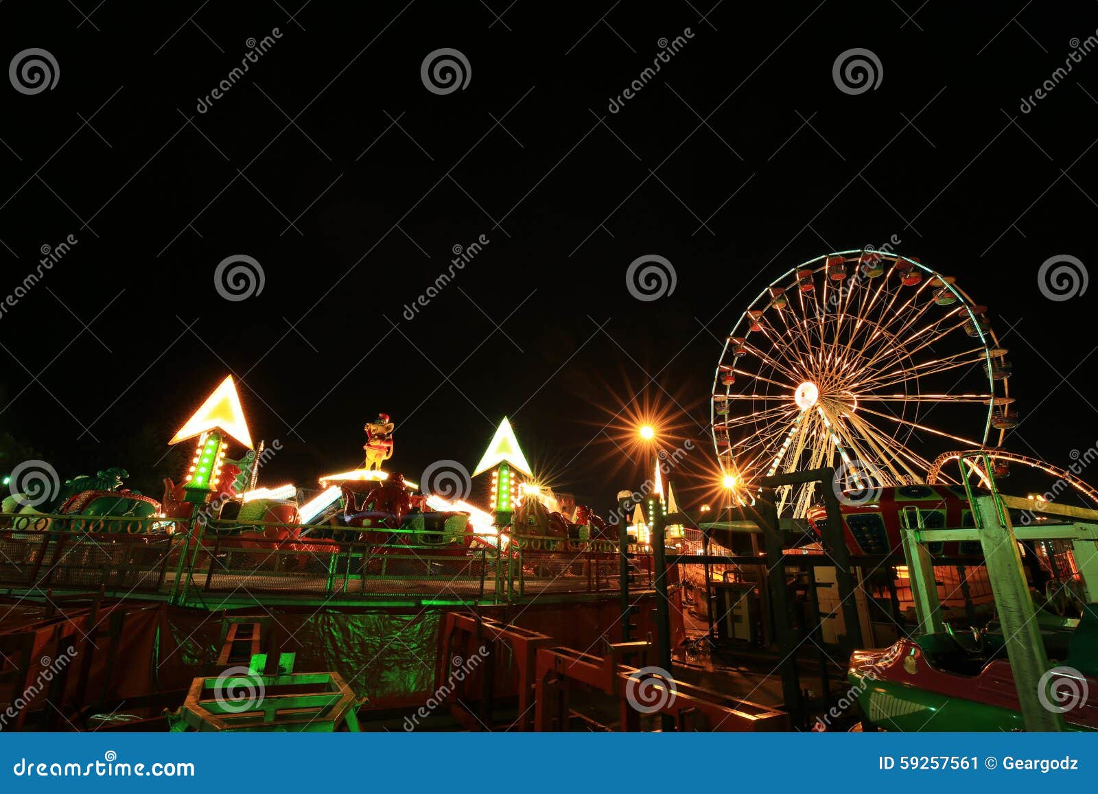 Amusement park at night stock image. Image of exposure - 59257561
