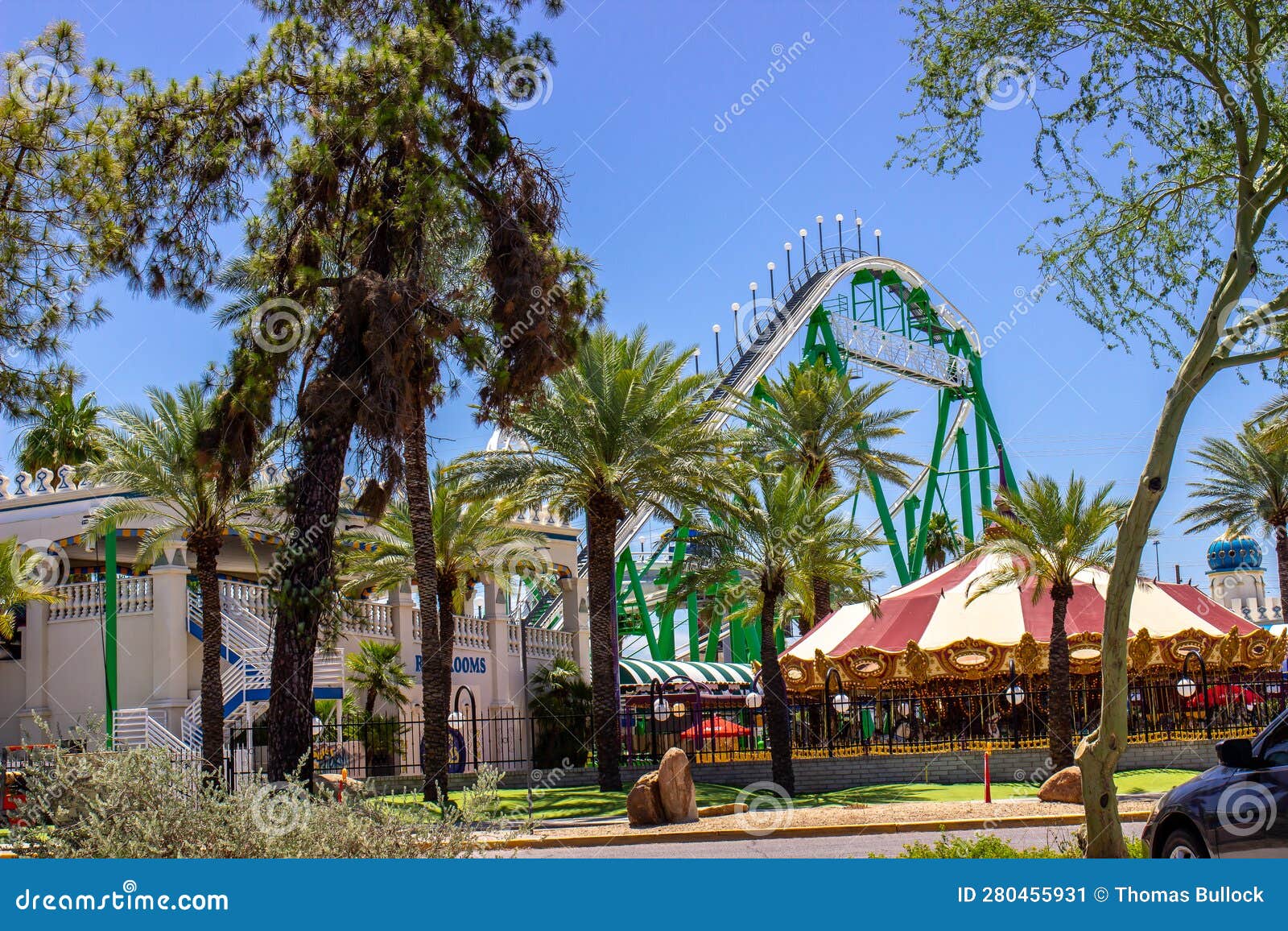 Amusement Park through Palm Trees Editorial Photo - Image of lawn ...