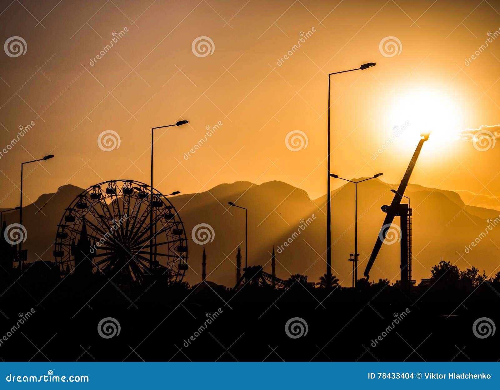 Amusement park at sunset stock photo. Image of park, light - 78433404