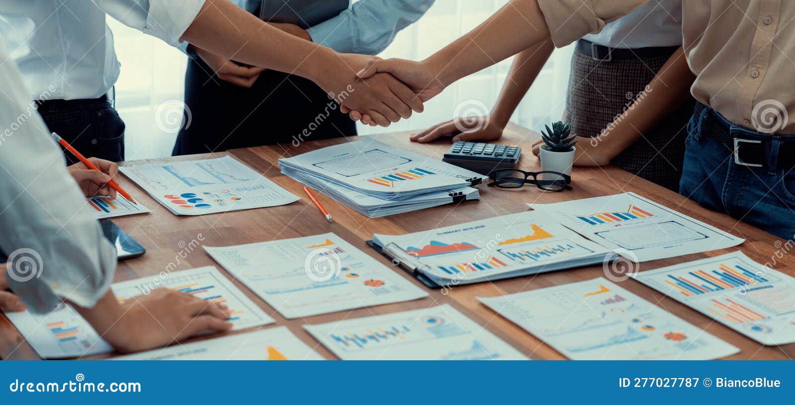 Analyst Team Celebrates Successful Data Analysis with Handshake ...