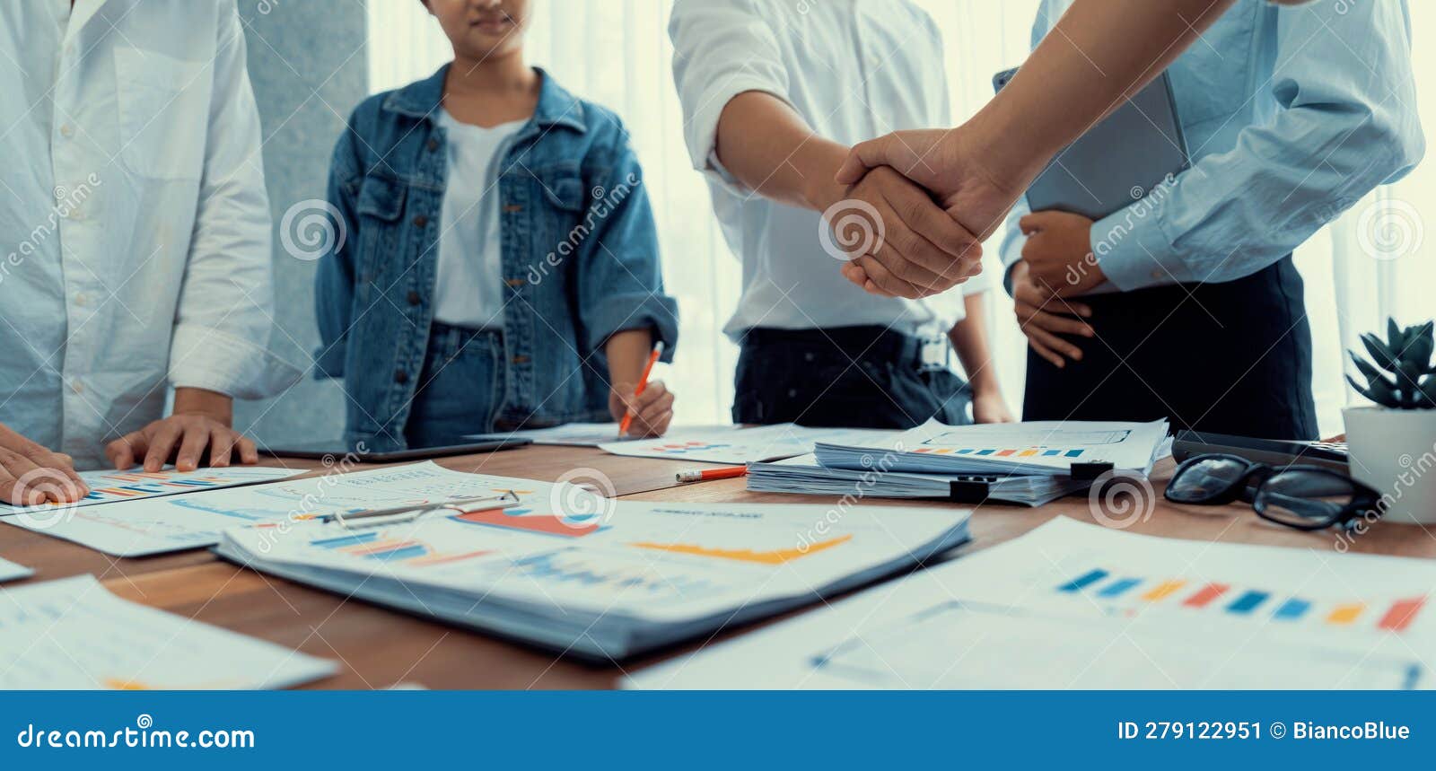 Analyst Team Celebrates Successful Data Analysis with Handshake ...