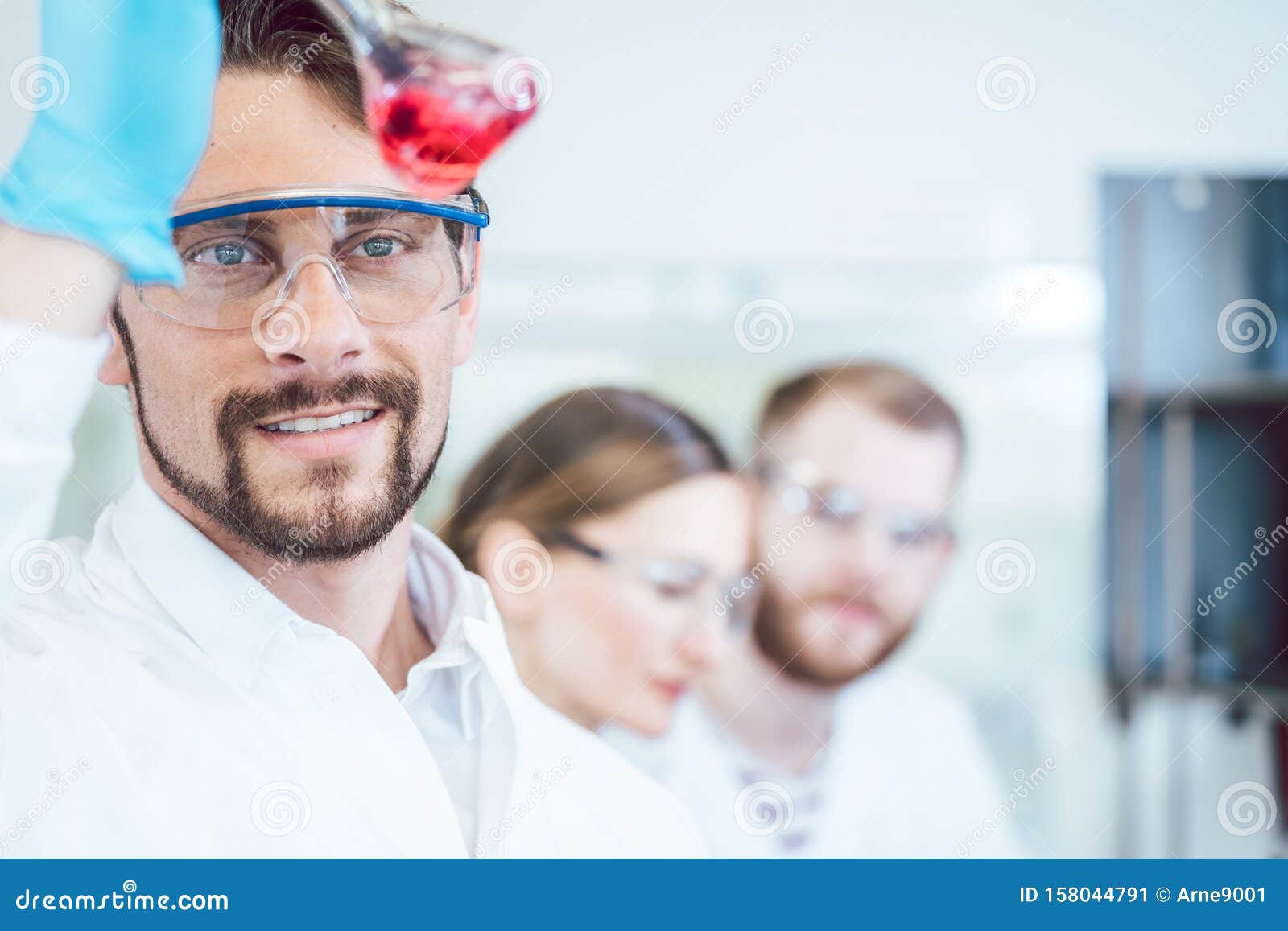 Analytical Chemist Analyzing a Red Solution Stock Image - Image of ...
